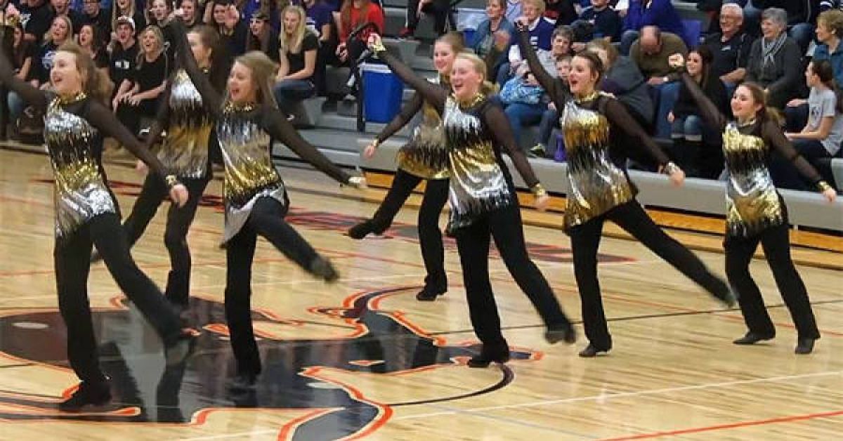 High school dancers keep going with their routine after the music cuts ...